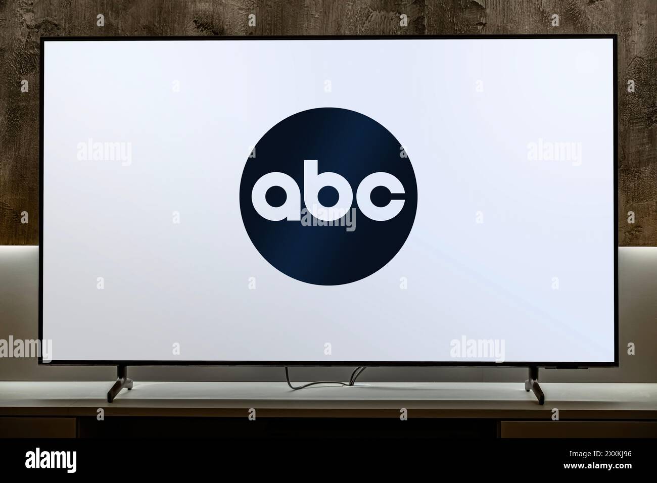 POZNAN, POL - MAR 01, 2024: Flat-screen TV set displaying logo of the American Broadcasting ...