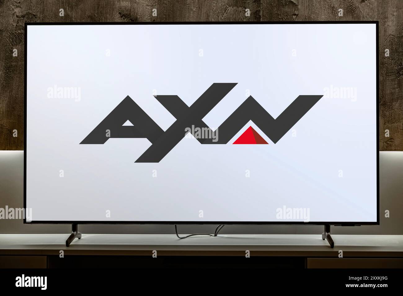 POZNAN, POL - APR 10, 2024: Flat-screen TV set displaying logo of AXN ...
