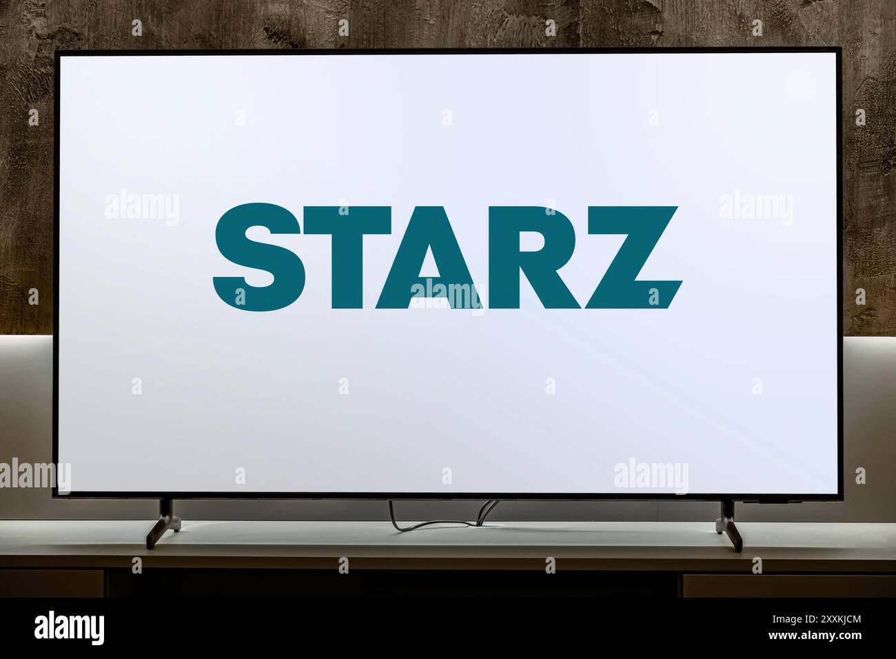 POZNAN, POL - MAY 06, 2024: Flat-screen TV set displaying logo of Starz, an American premium ...