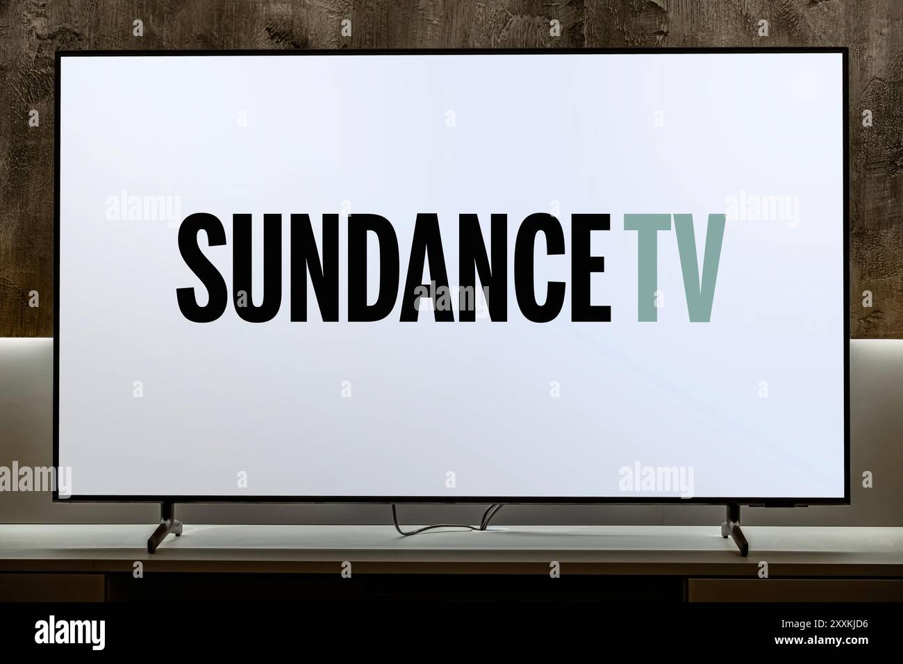 POZNAN, POL - APR 10, 2024: Flat-screen TV set displaying logo of ...