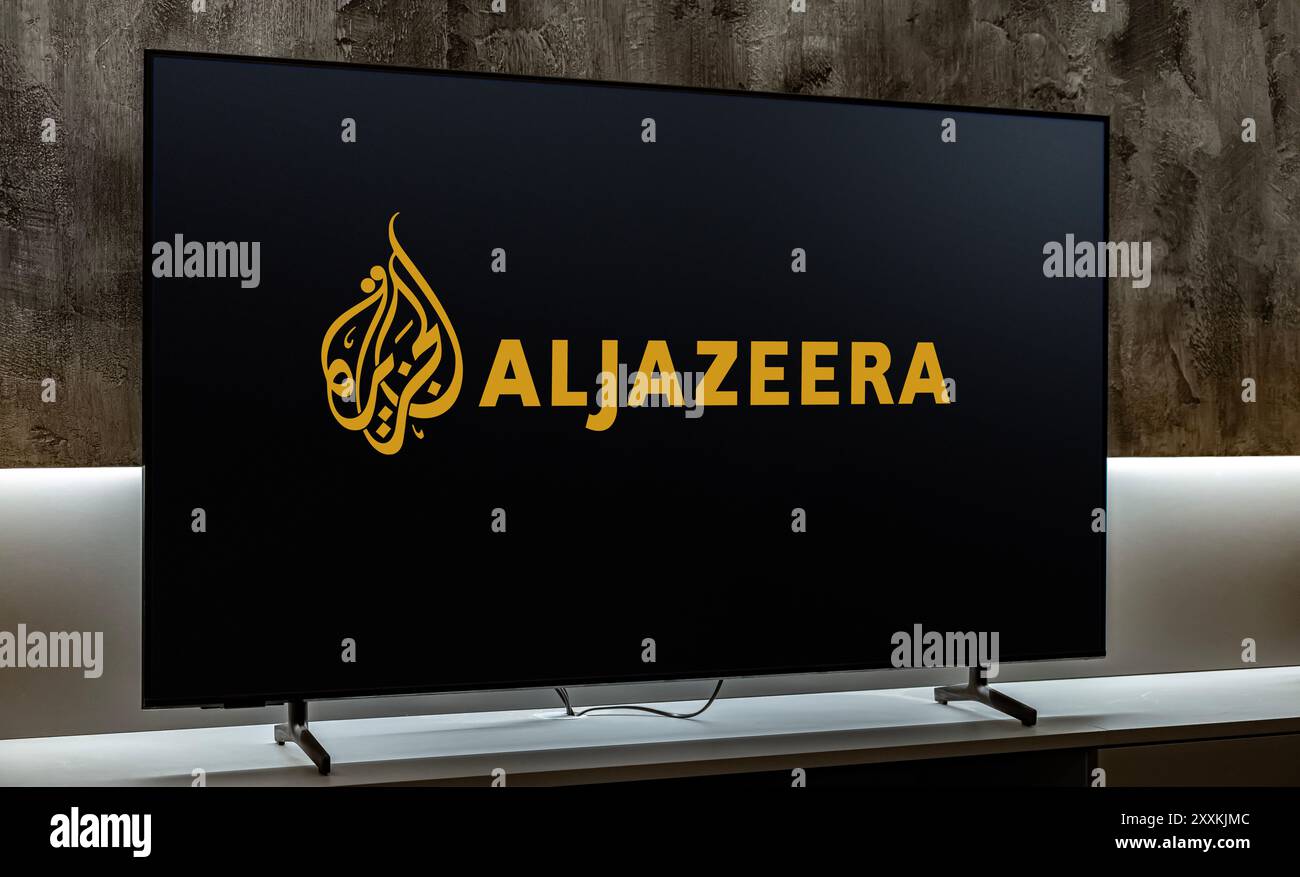 POZNAN, POL - JUL 31, 2024: Flat-screen TV set displaying logo of Al Jazeera, a 24-hour English ...