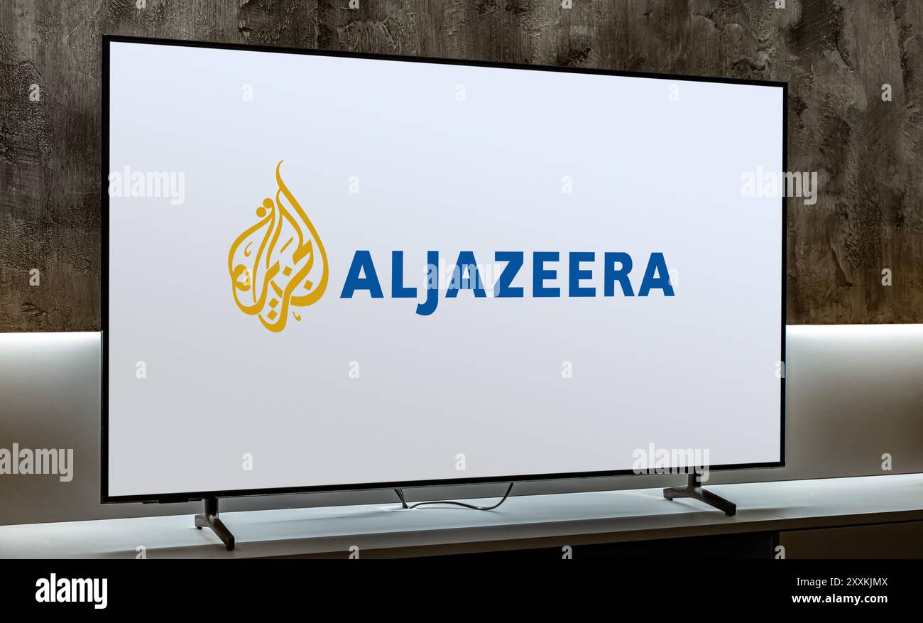 POZNAN, POL - JUL 31, 2024: Flat-screen TV set displaying logo of Al Jazeera, a 24-hour English ...