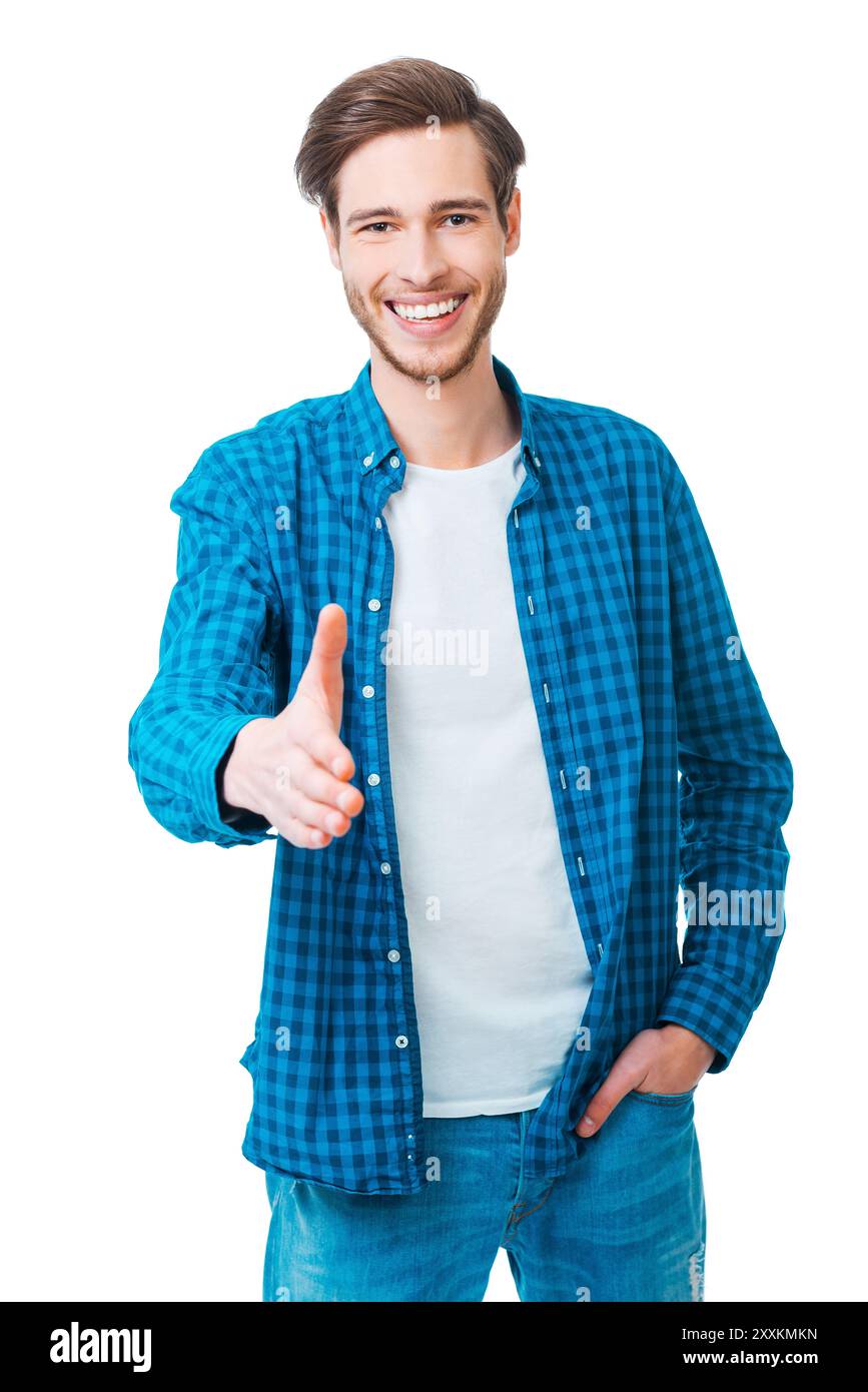Congratulations! Portrait of cheerful young man stretching out hand for ...