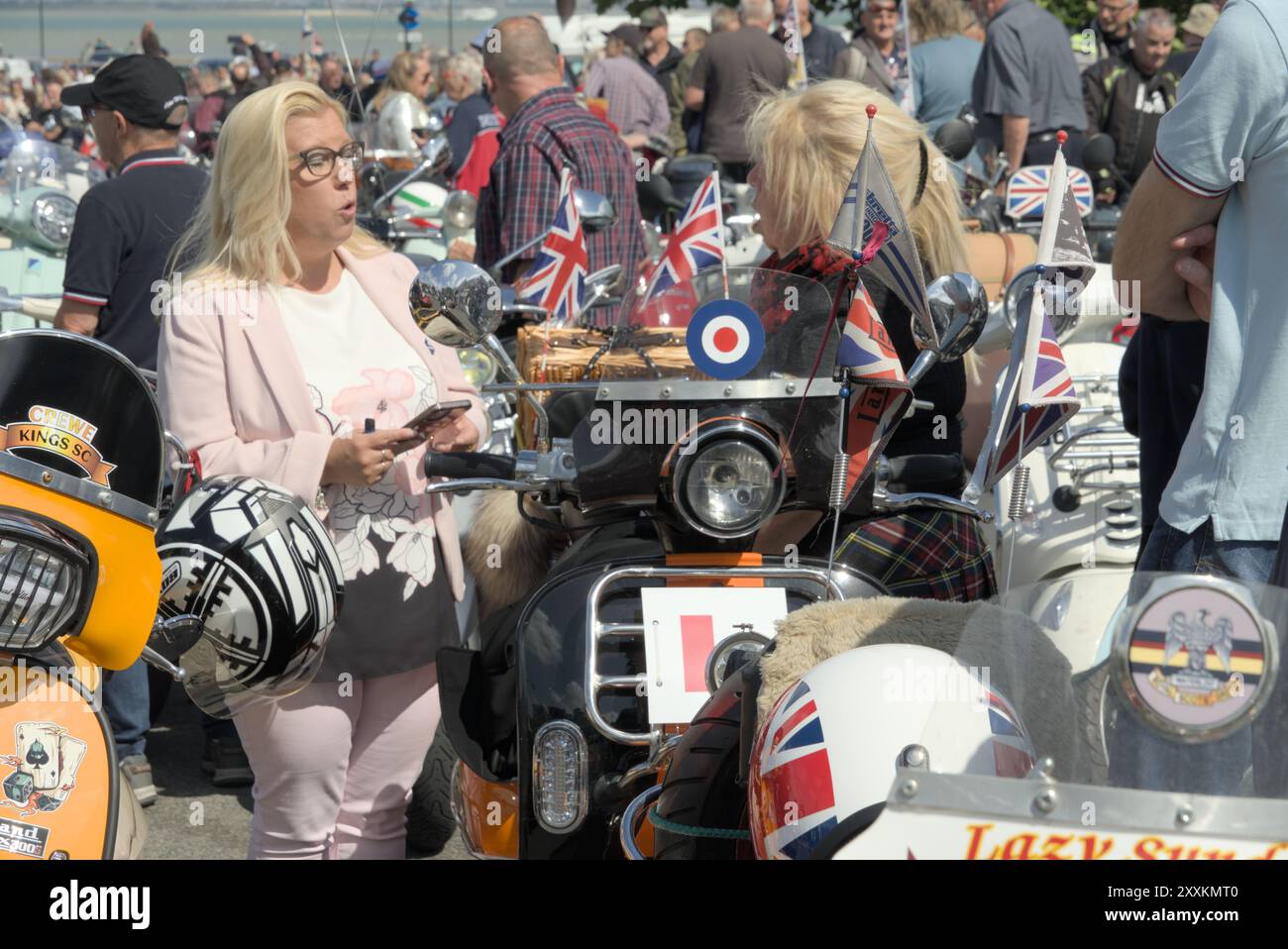 Two women talking at the Isle of Wight, United kingdom Scooter Rally ...