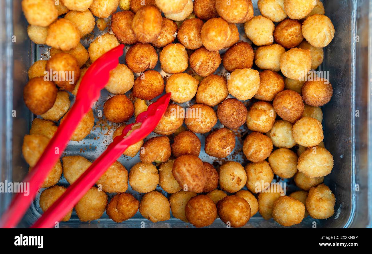 Fried cheese balls in a metal container Stock Photo - Alamy