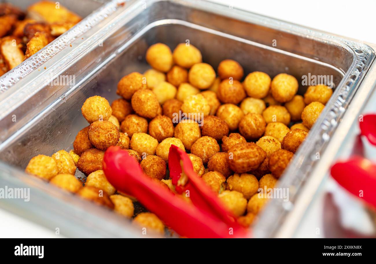 Fried cheese balls in a metal container Stock Photo - Alamy