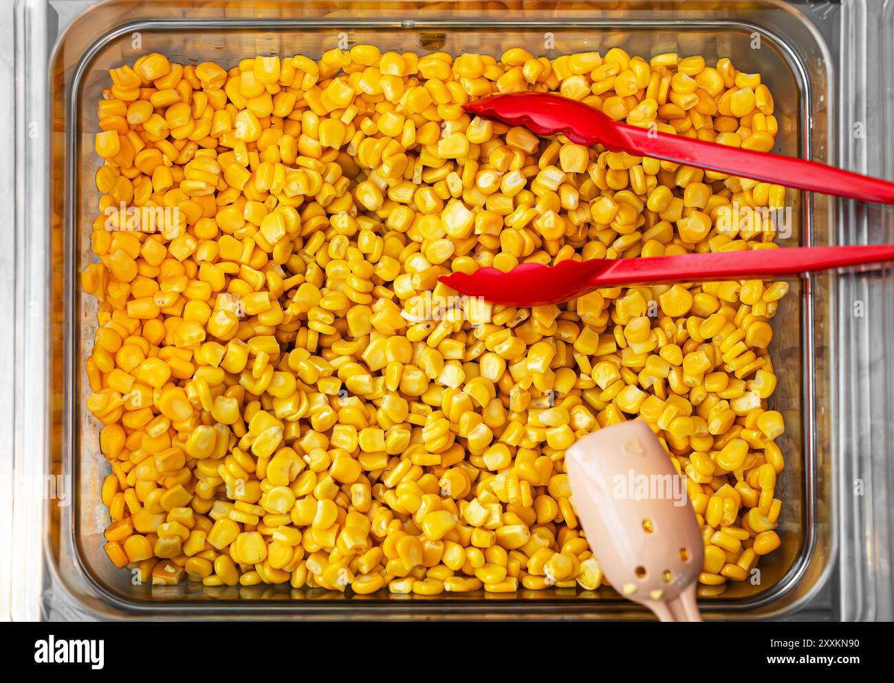 Boiled corn in a metal container Stock Photo - Alamy