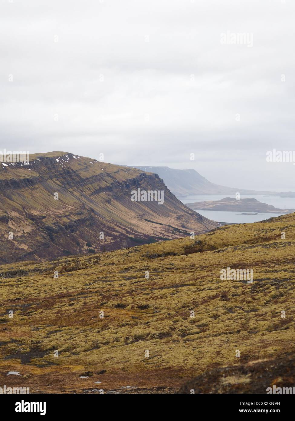 An expansive landscape showing mountain ranges and deep valleys ...