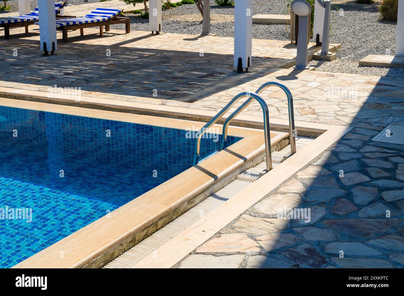 Summer pool scene with shimmering water, sunlit Stock Photo - Alamy