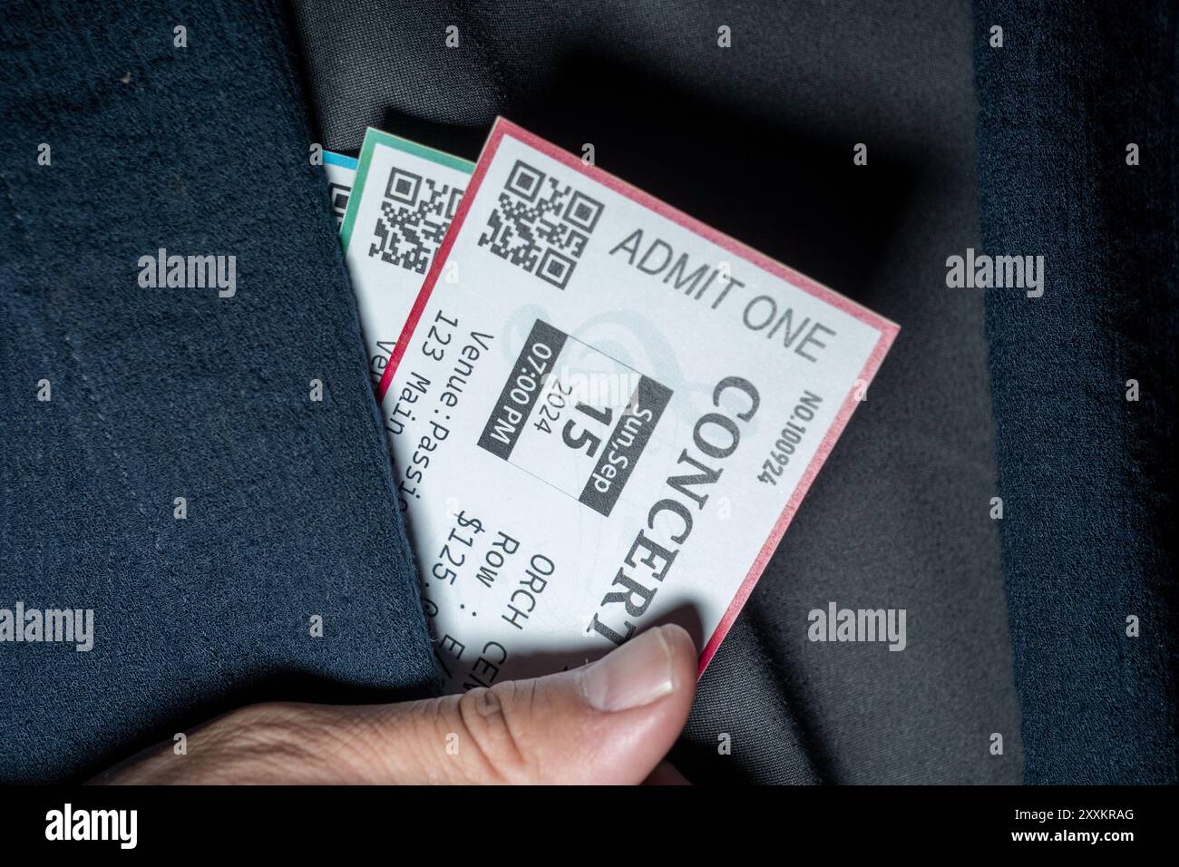 A hand extracts three concert tickets from a pocket, a common tactic ...
