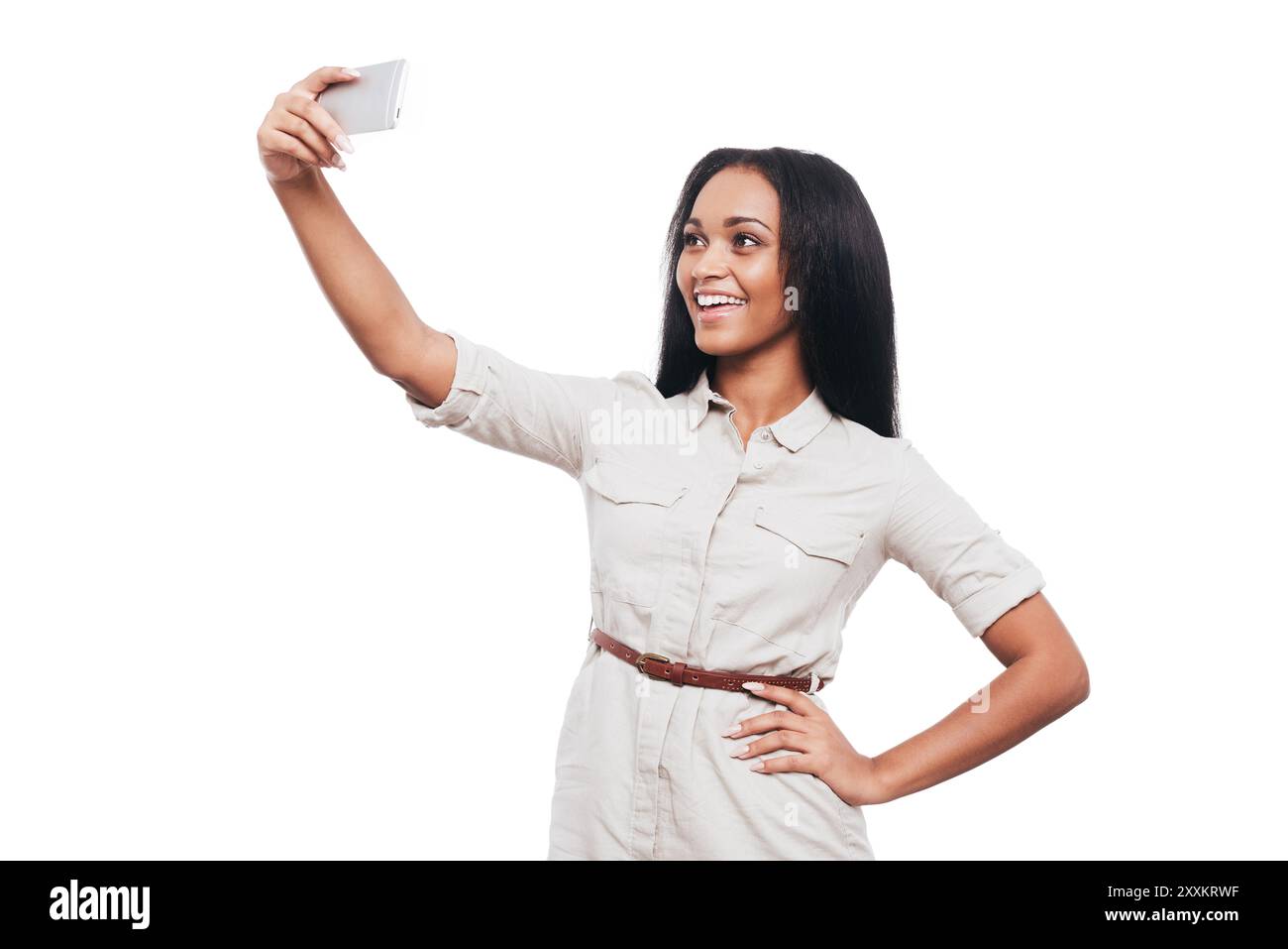 Selfie time. Beautiful young African woman making selfie by her smart ...
