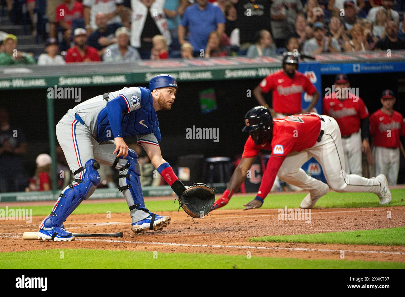 Texas Rangers' Carson Kelly, front, waits for the throw as Cleveland ...