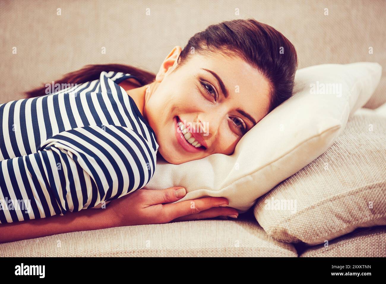 Taking time to relax. Beautiful young woman leaning her head on the ...