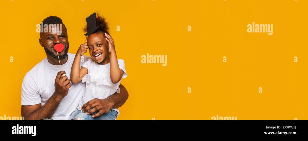 Joyful Father and Daughter Bonding Time With Fun Props Stock Photo - Alamy