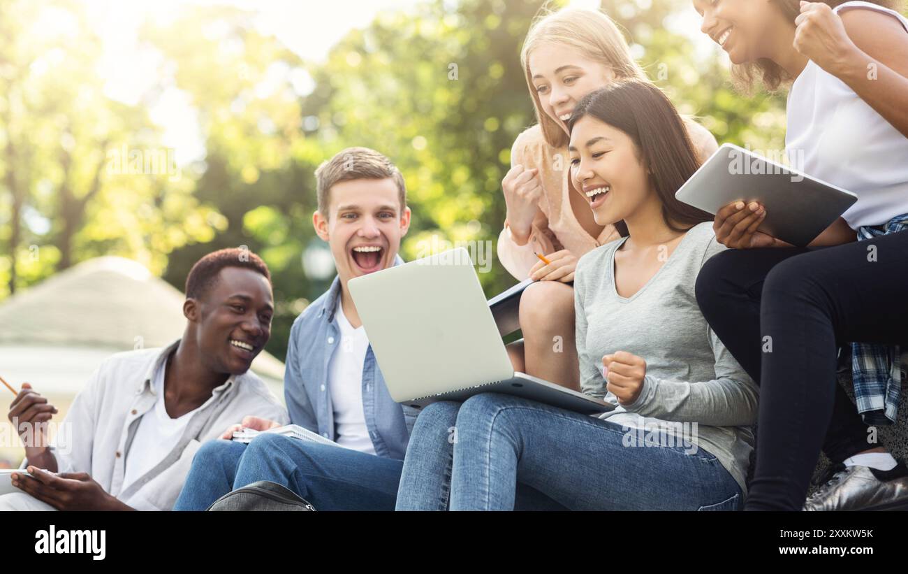 Group of international students celebrating success, checking exam ...