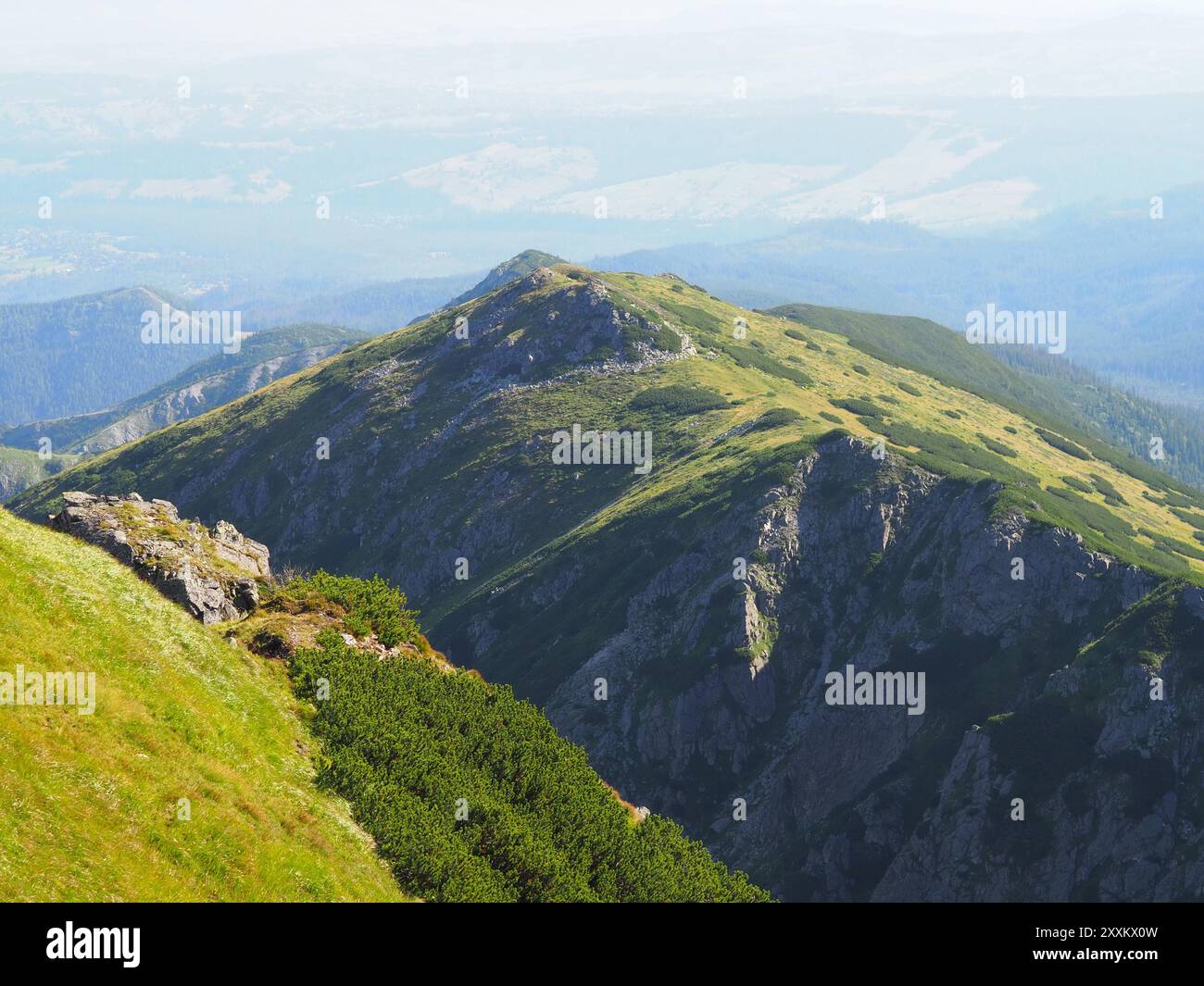 A breathtaking view of a lush, green mountainous ridge, showing the ...