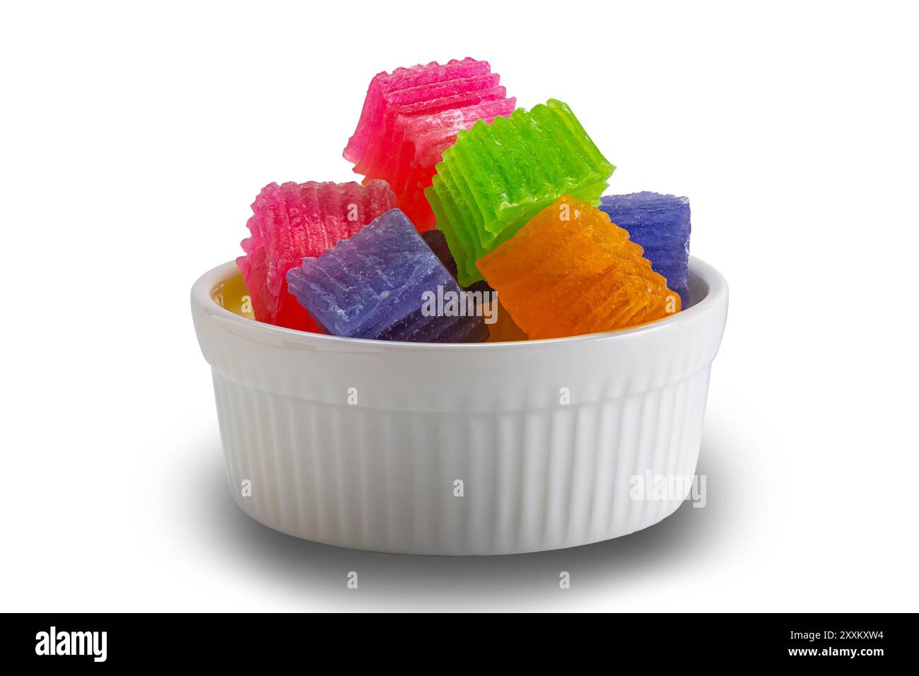 Cube shape crispy jelly. Closeup view pile of sweet cube shape crispy jelly in white ceramic ...