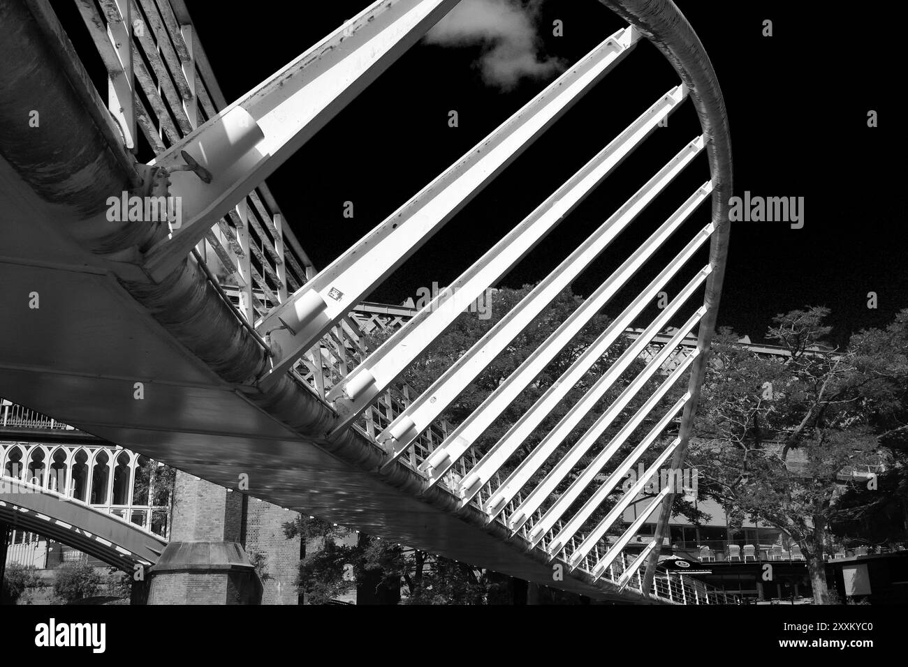 Structural detail of a curved bridge with beams and a building in the ...