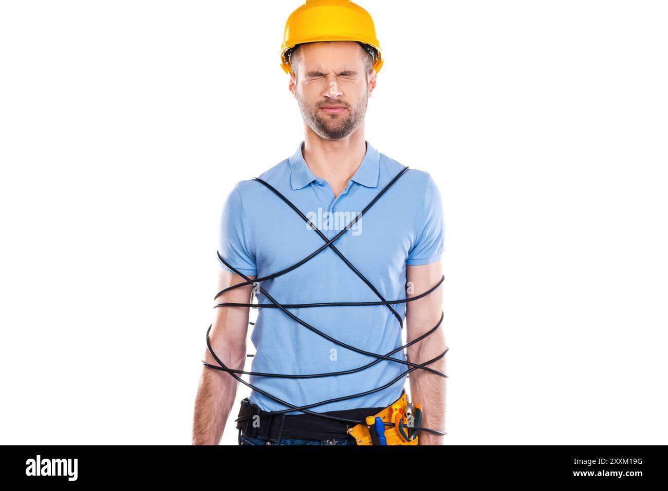 Failed again. Frustrated young male carpenter trapped in wire holding ...