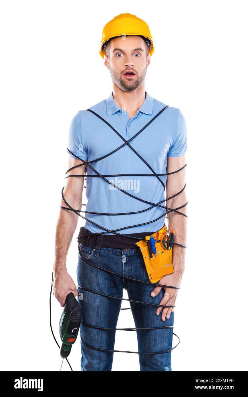Frustrated carpenter. Frustrated young male carpenter trapped in wire ...