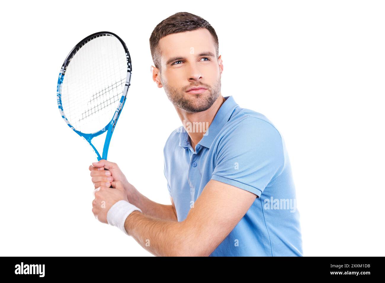 Confident player. Confident young man holding tennis racket and looking ...