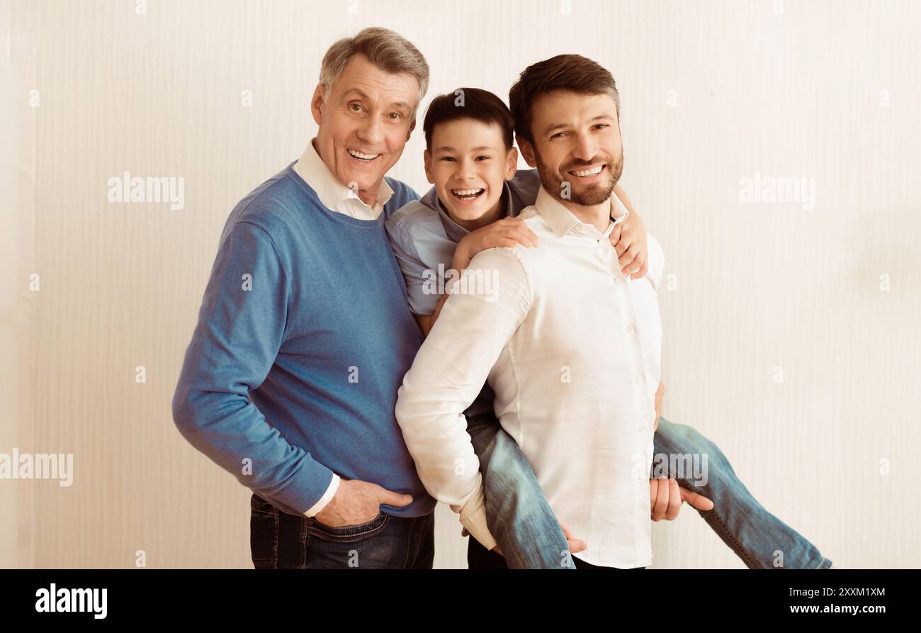 Boy, Father And Grandpa Posing Standing Against White Wall Indoor Stock ...