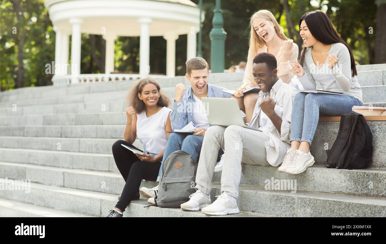 Group of students celebrating success, checking exam results online ...