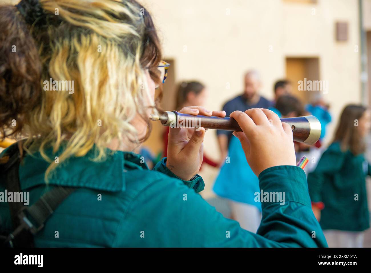 Street musician playing traditional human towers music with a gralla in ...