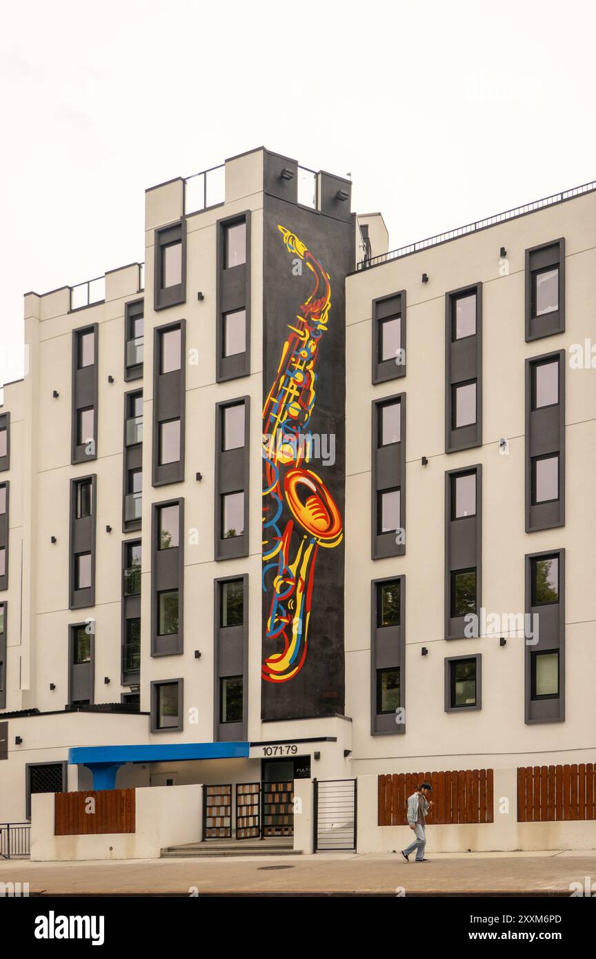 Large saxophone on the side of a apartment building on Fulton street in ...