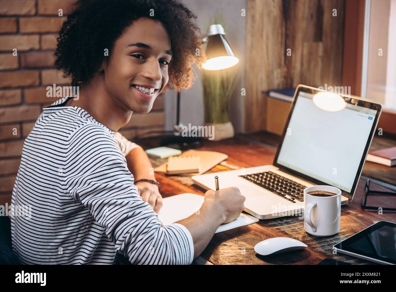 African descent man notebook hi-res stock photography and images - Alamy