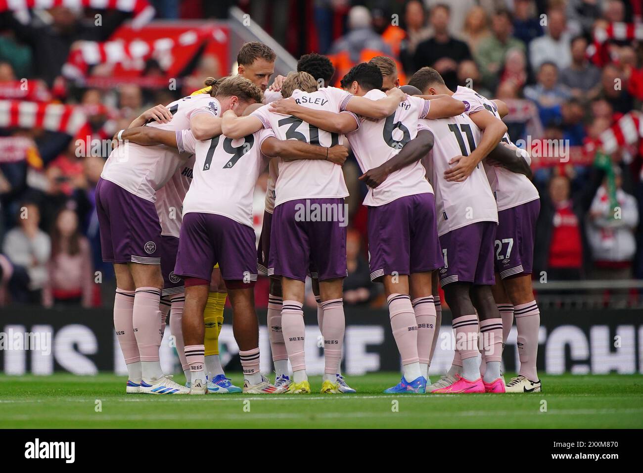 Brentford players form a huddle ahead of the Premier League match at ...