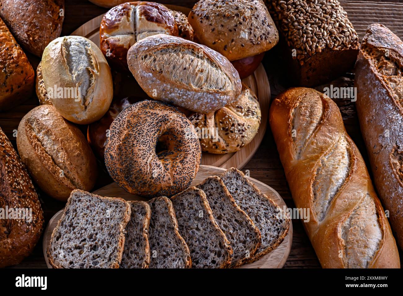 Assorted bakery products including loaves of bread and rolls Stock ...