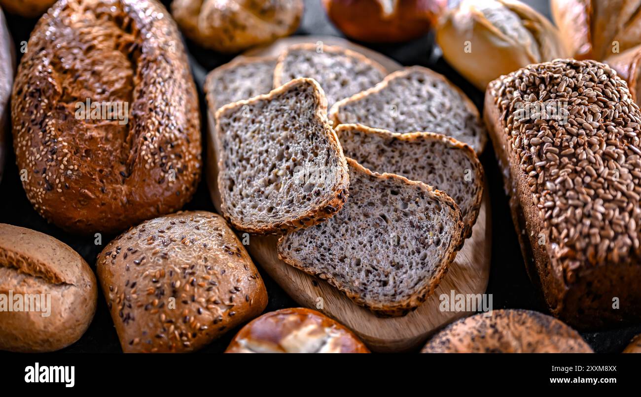 Assorted bakery products including loaves of bread and rolls Stock ...