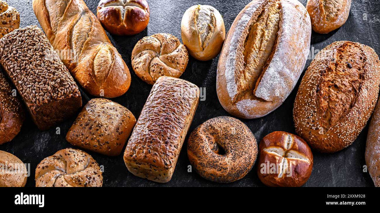 Assorted bakery products including loaves of bread and rolls Stock ...