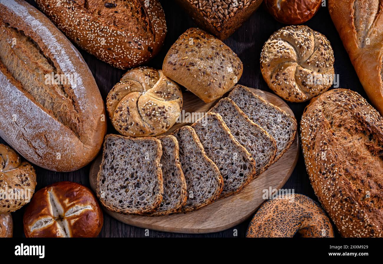 Assorted bakery products including loaves of bread and rolls Stock ...