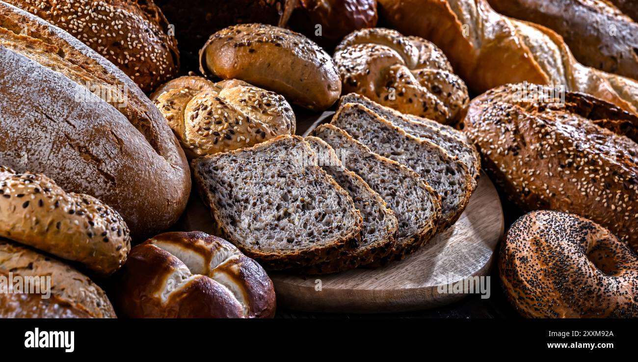 Assorted bakery products including loaves of bread and rolls Stock ...