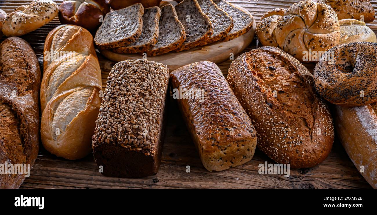 Assorted bakery products including loaves of bread and rolls Stock ...