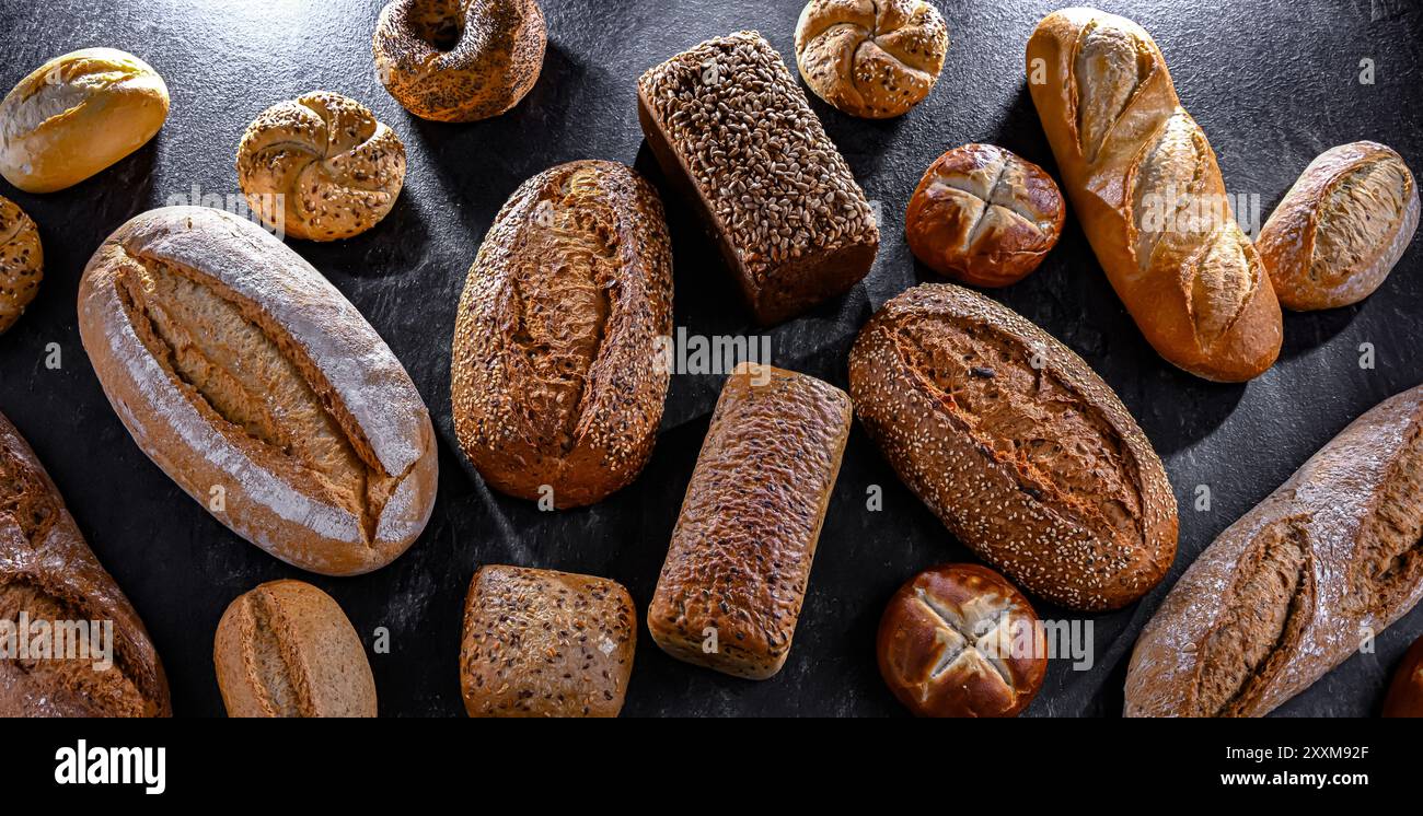 Assorted bakery products including loaves of bread and rolls Stock ...