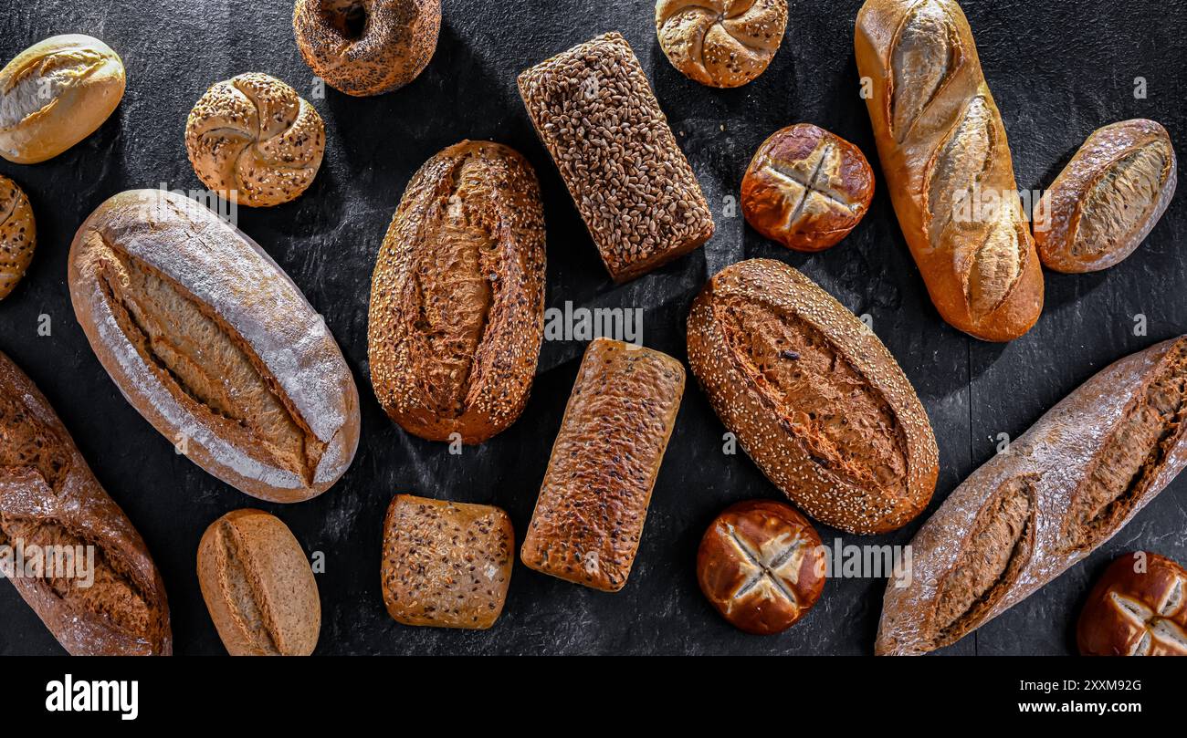 Assorted bakery products including loaves of bread and rolls Stock ...