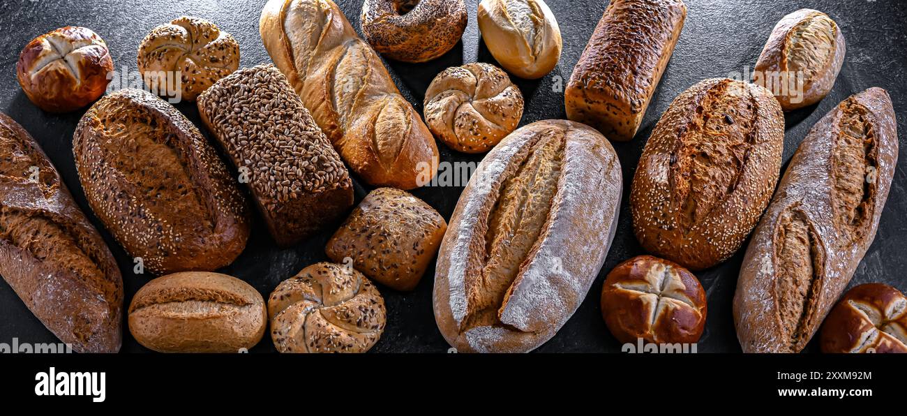 Assorted bakery products including loaves of bread and rolls Stock ...