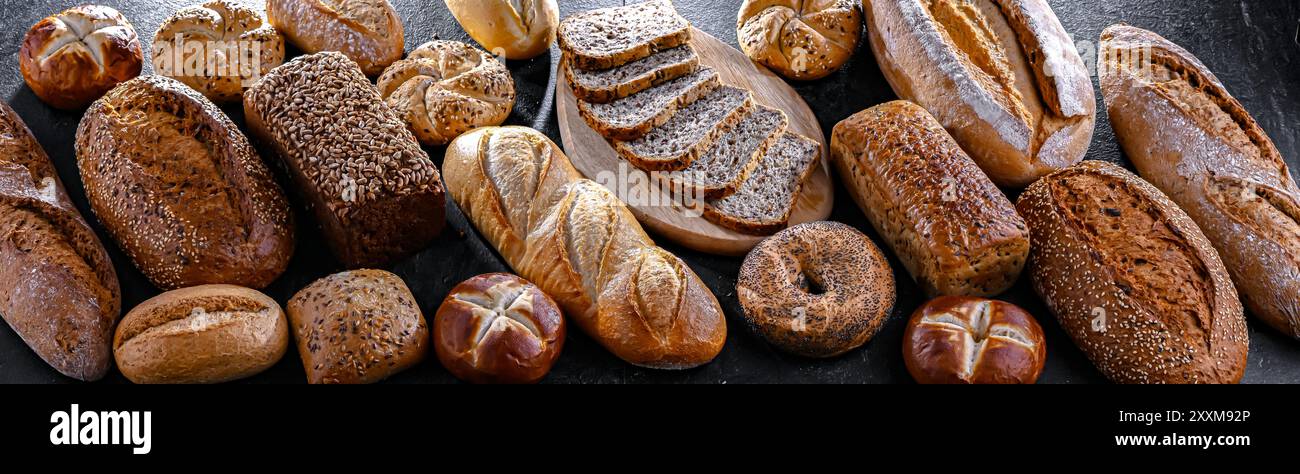 Assorted bakery products including loaves of bread and rolls Stock ...