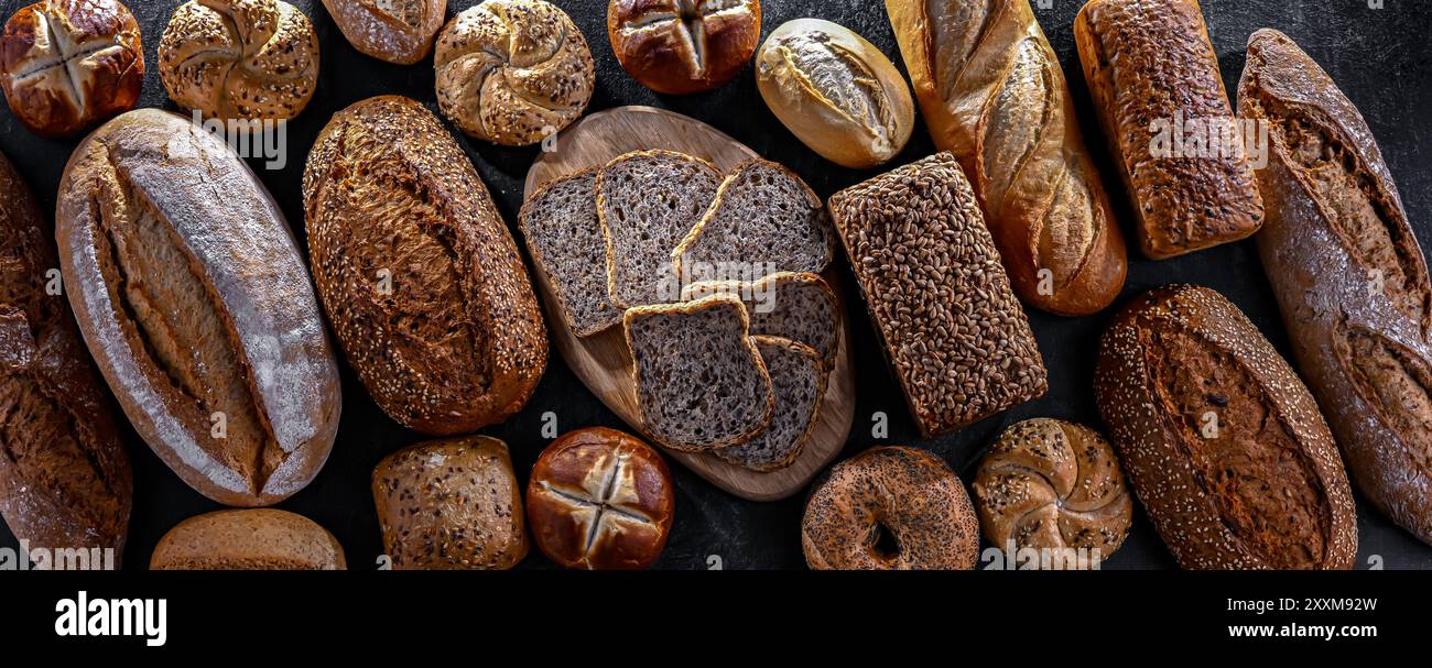 Assorted bakery products including loaves of bread and rolls Stock ...