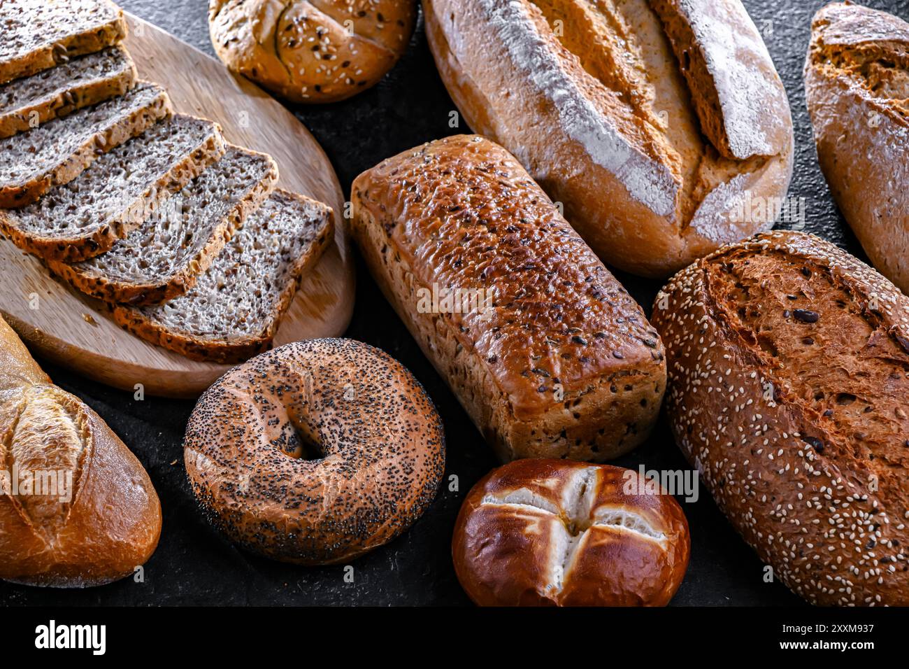Assorted bakery products including loaves of bread and rolls Stock ...