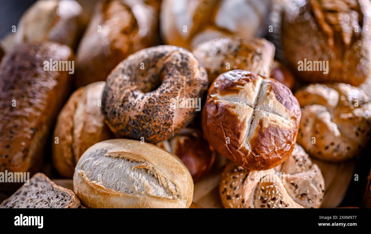 Assorted bakery products including loaves of bread and rolls Stock ...
