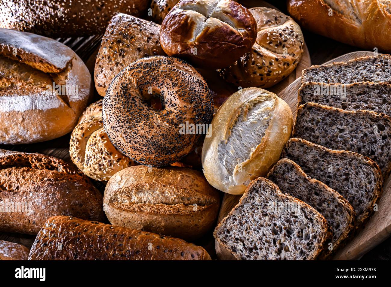 Assorted bakery products including loaves of bread and rolls Stock ...