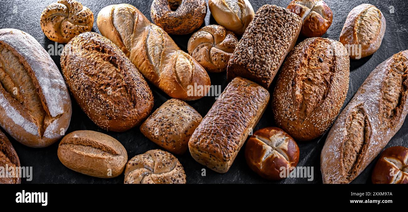 Assorted bakery products including loaves of bread and rolls Stock ...