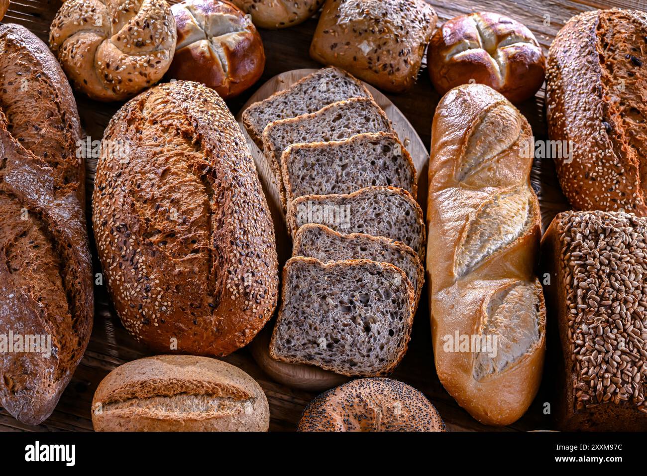 Assorted bakery products including loaves of bread and rolls Stock ...