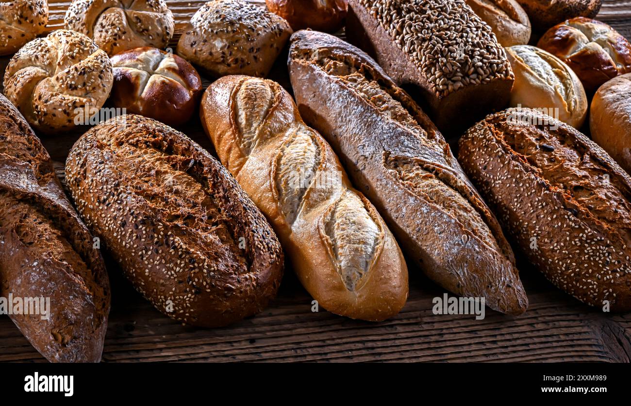 Assorted bakery products including loaves of bread and rolls Stock ...