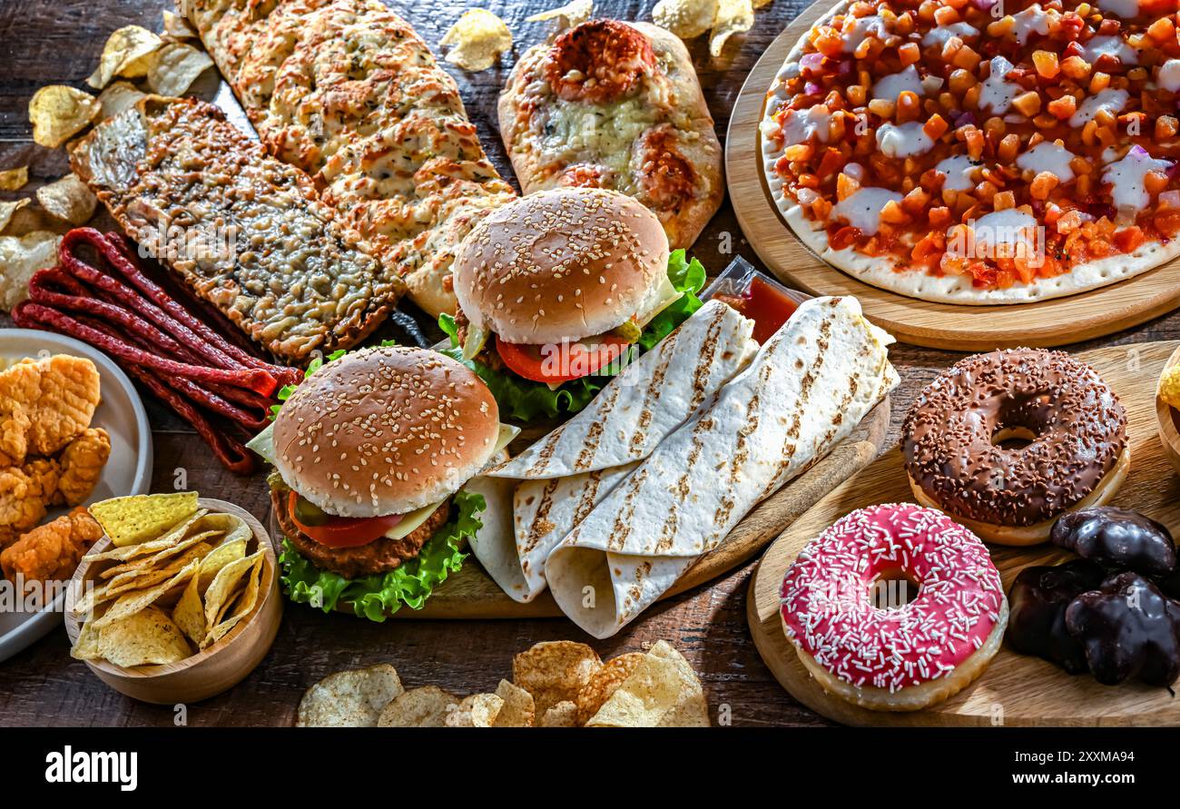Foods enhancing the risk of cancer. Junk food Stock Photo - Alamy