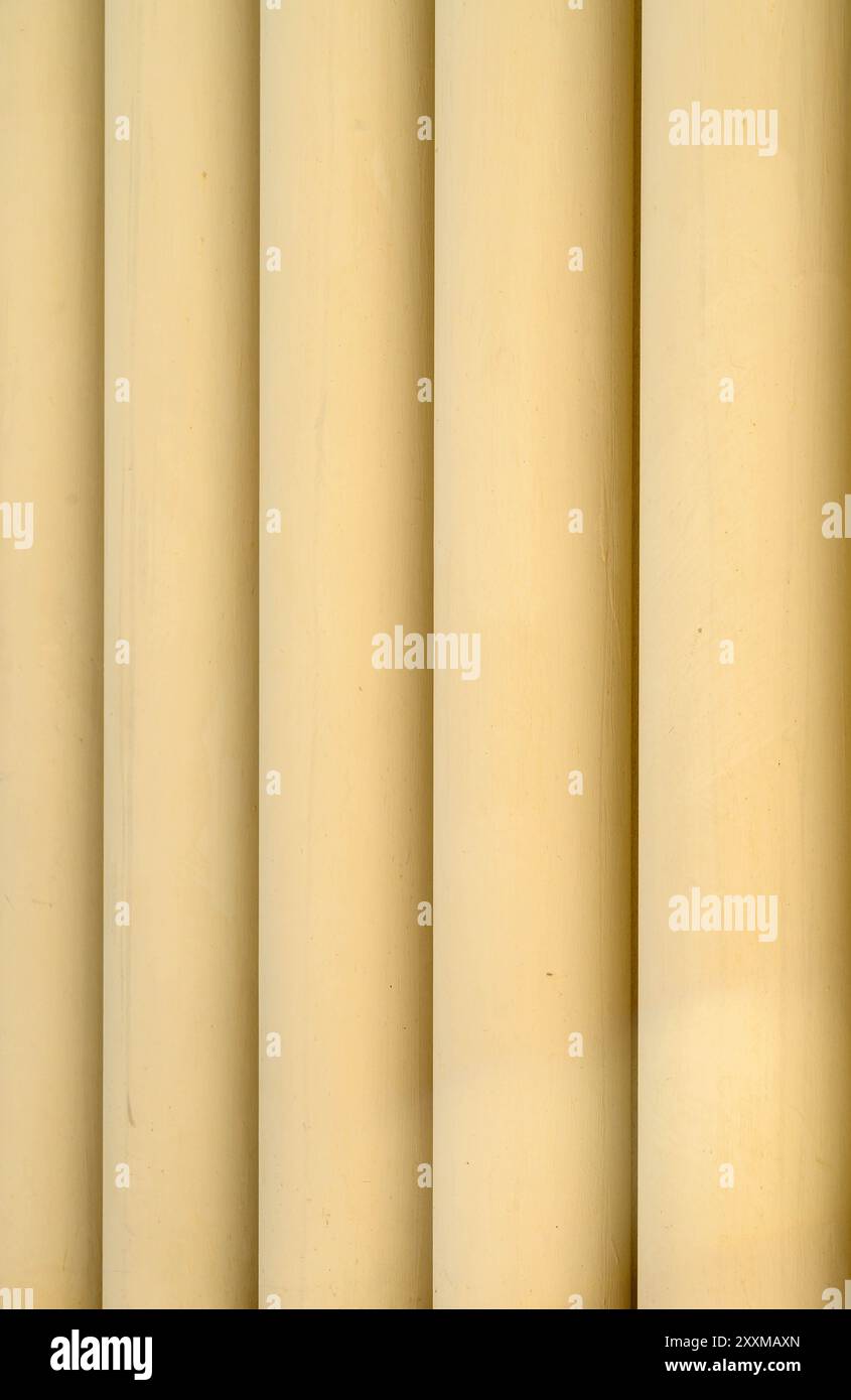 Yellow plastic pipes full frame Stock Photo - Alamy